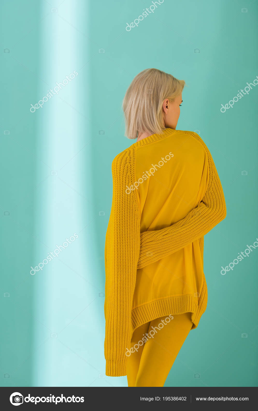 Back View Woman Yellow Sweater Posing Blue Background — Free Stock ...