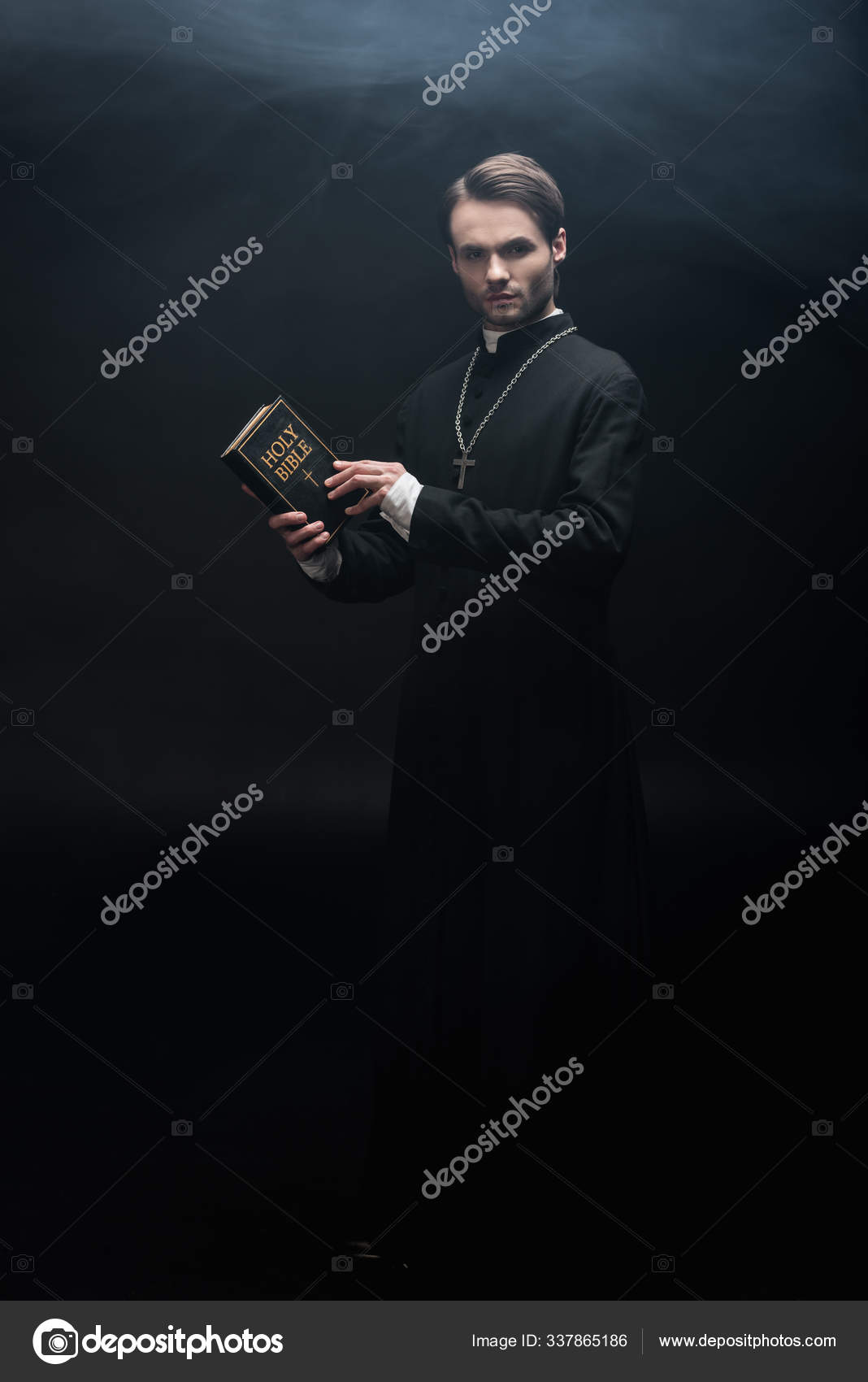Full Length View Strict Catholic Priest Holding Holy Bible Looking ...