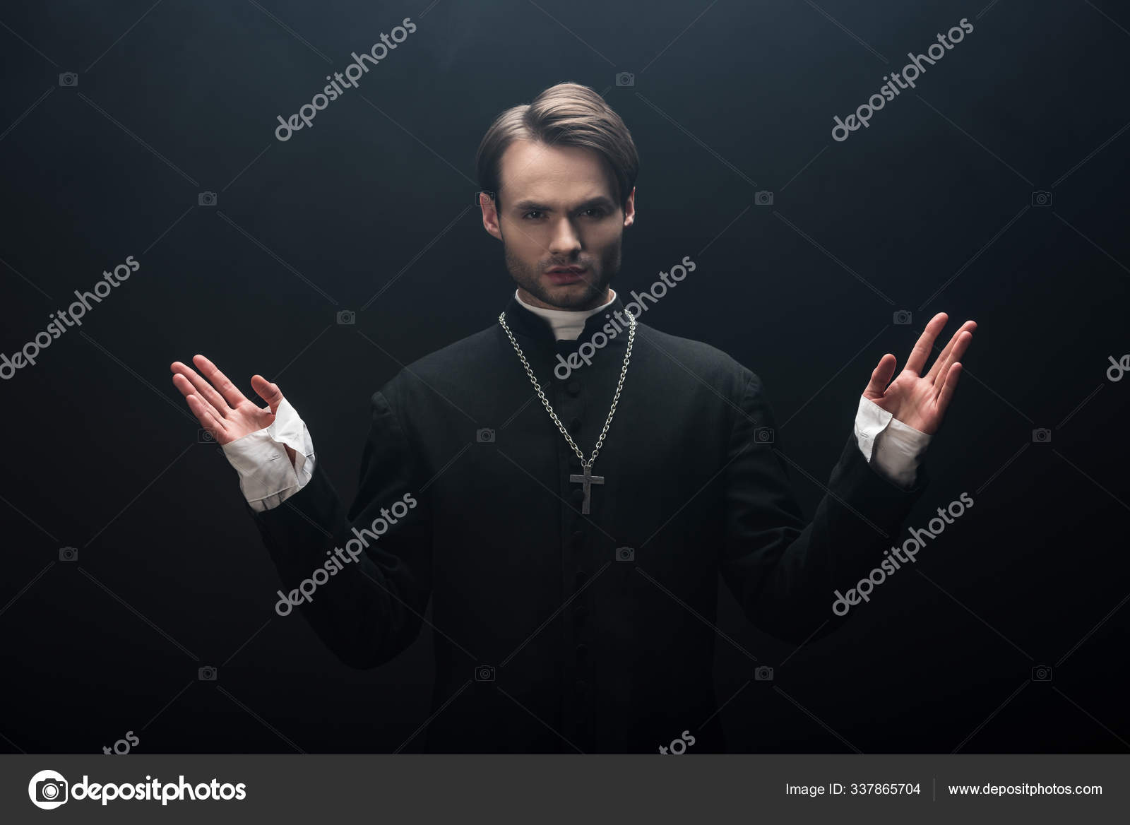 Young Confident Catholic Priest Looking Camera While Standing Open Arms ...