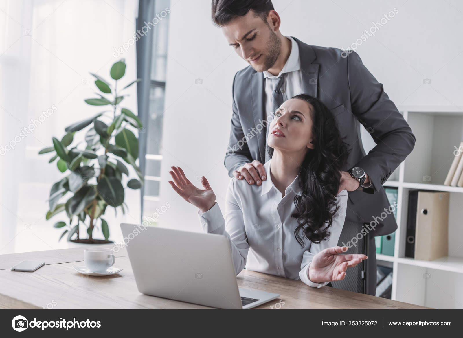 Handsome Businessman Touching Shoulders Displeased Secretary Sitting ...