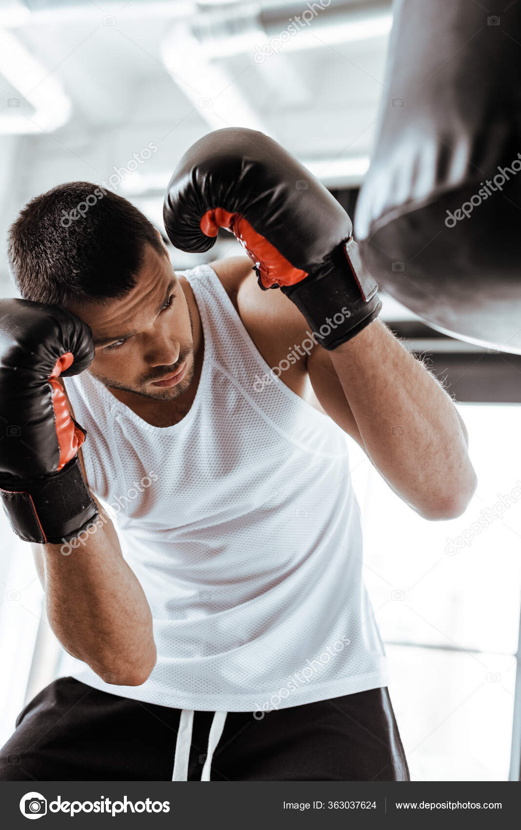 Selective Focus Handsome Man Boxing Gloves Training Punching Bag ...