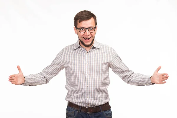 Young jocular man showing presentation, pointing on placard Stock Photo ...