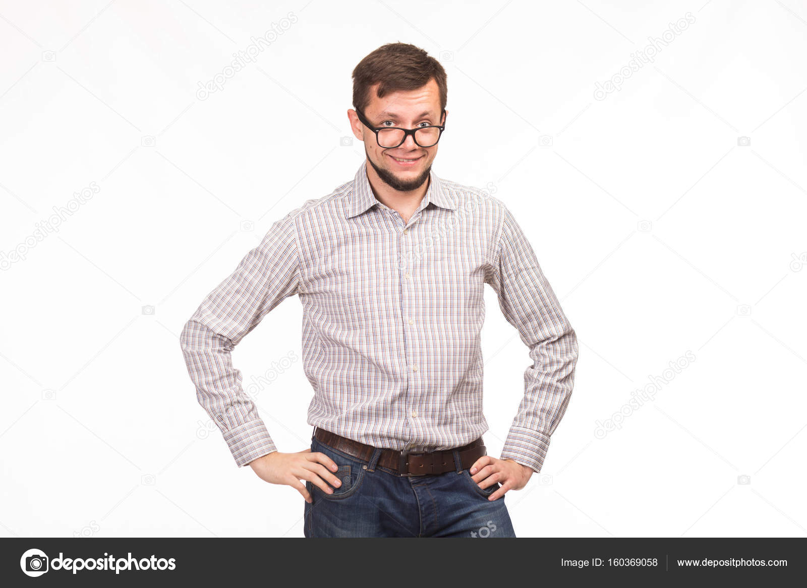 Young jocular man showing presentation, pointing on placard Stock Photo ...