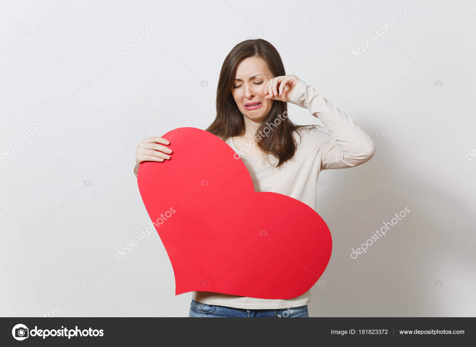 Sad upset lamentable weeping crying woman holding big red heart Stock ...