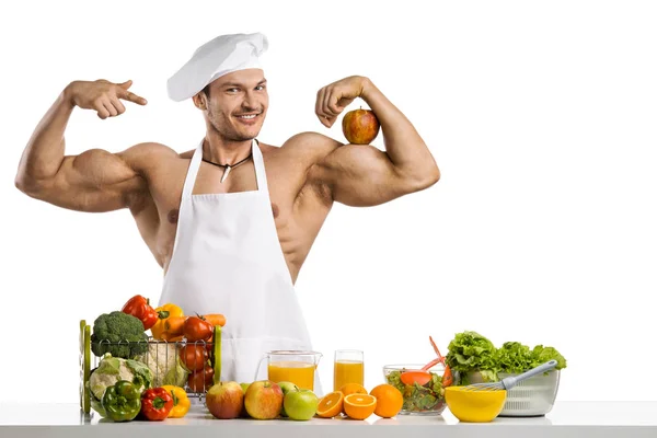 Man bodybuilder cook with apple on biceps Stock Photo by ©tankist276 ...