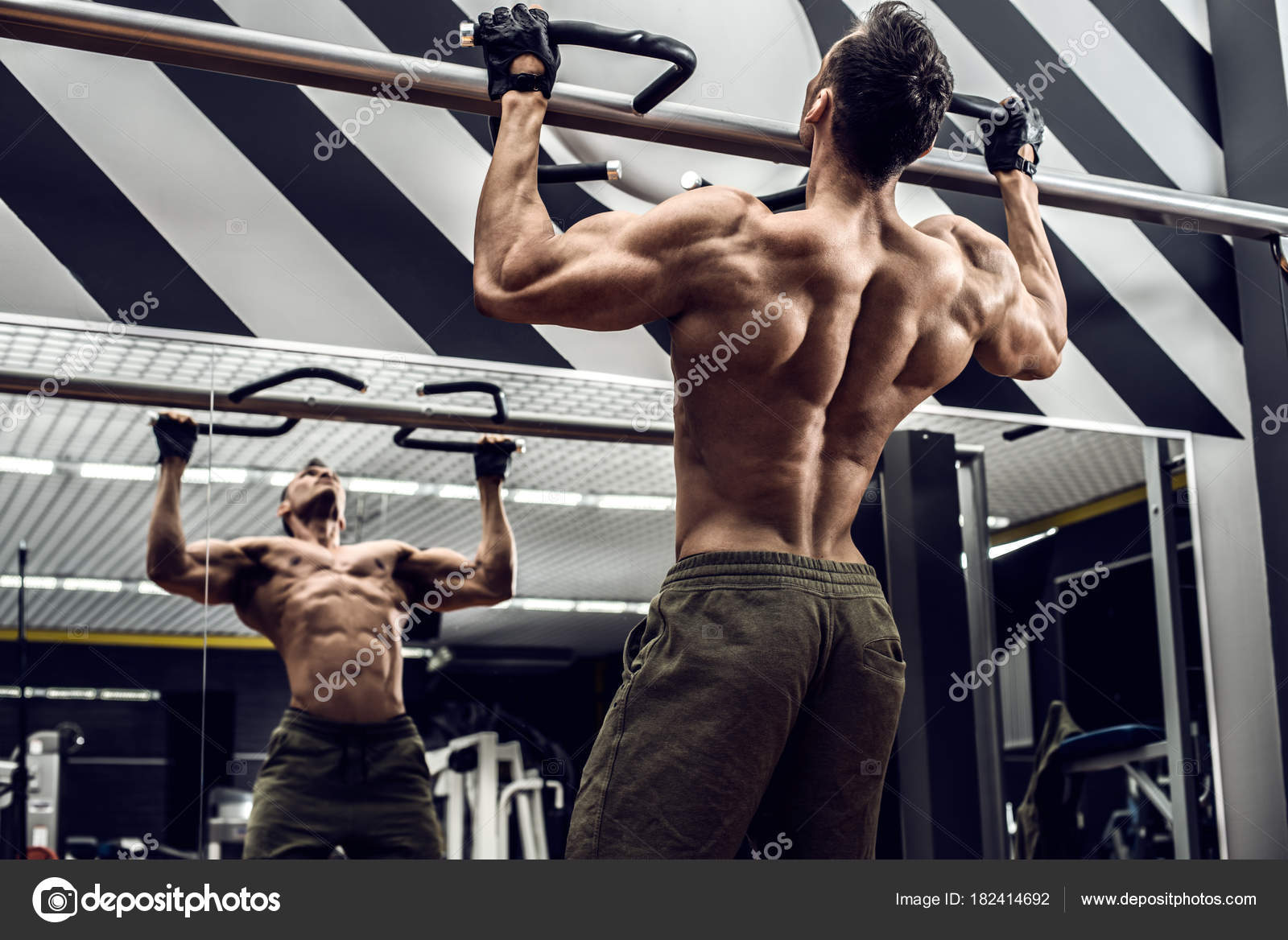 Bodybuilder pose in gym — Stock Photo © tankist276 #182414692