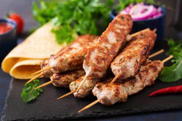 Lula kebab with lavash on cutting board - Stock Image - Everypixel