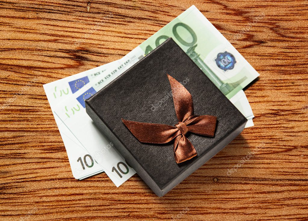 Gift box with euro banknotes Stock Photo by ©Garsya 126477734