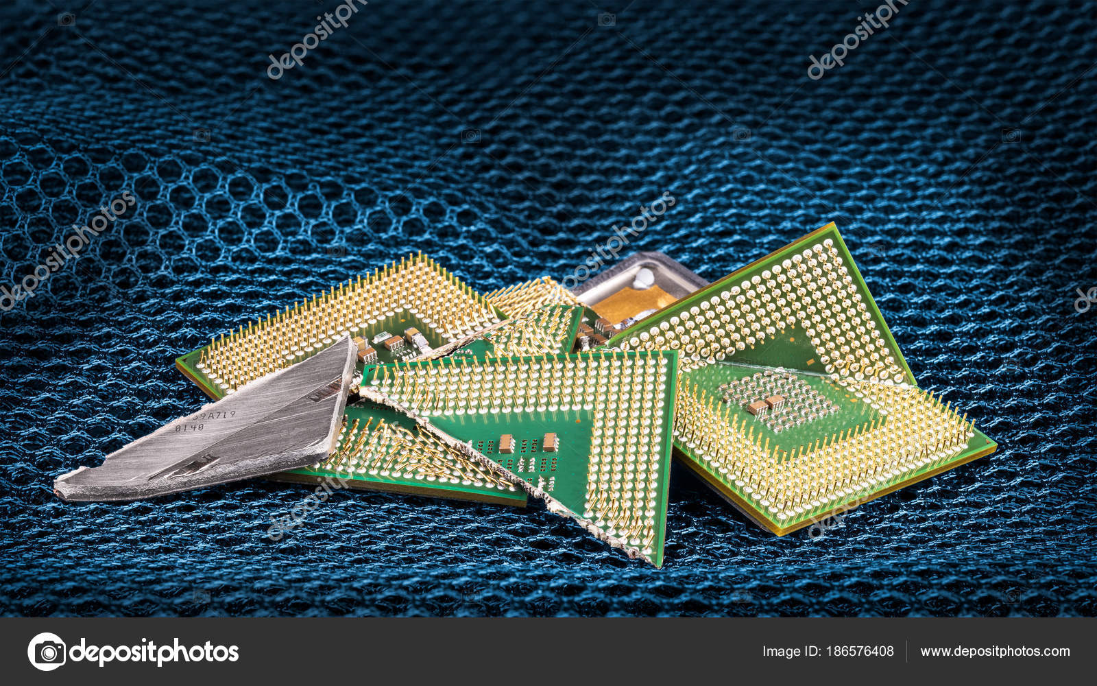 Broken computer processors on blue hexagonal textured mesh Stock Photo ...