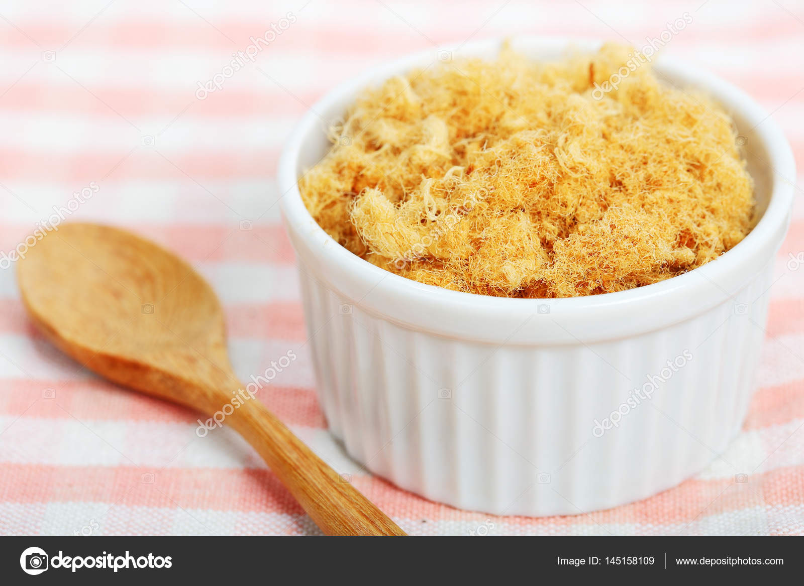 Dried pork floss in white cup with wooden spoon Stock Photo by ©kongsky ...