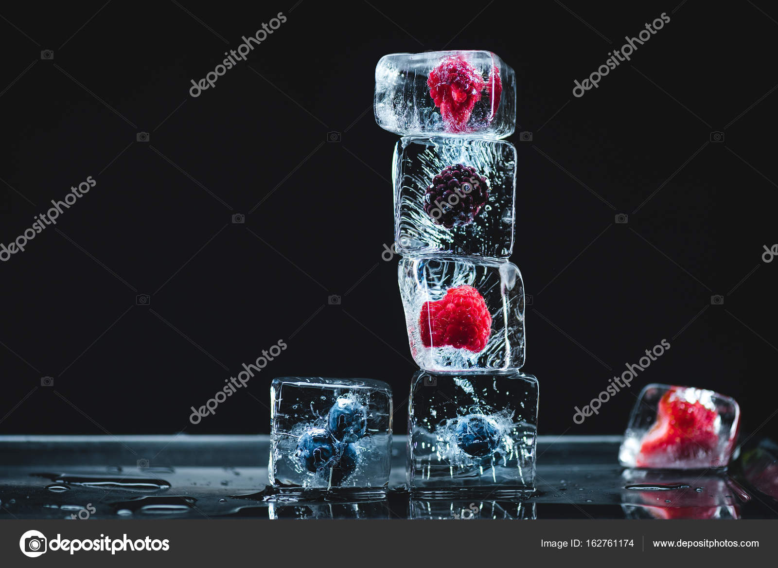 Frozen fruits in ice cubes Stock Photo by ©VadimVasenin 162761174