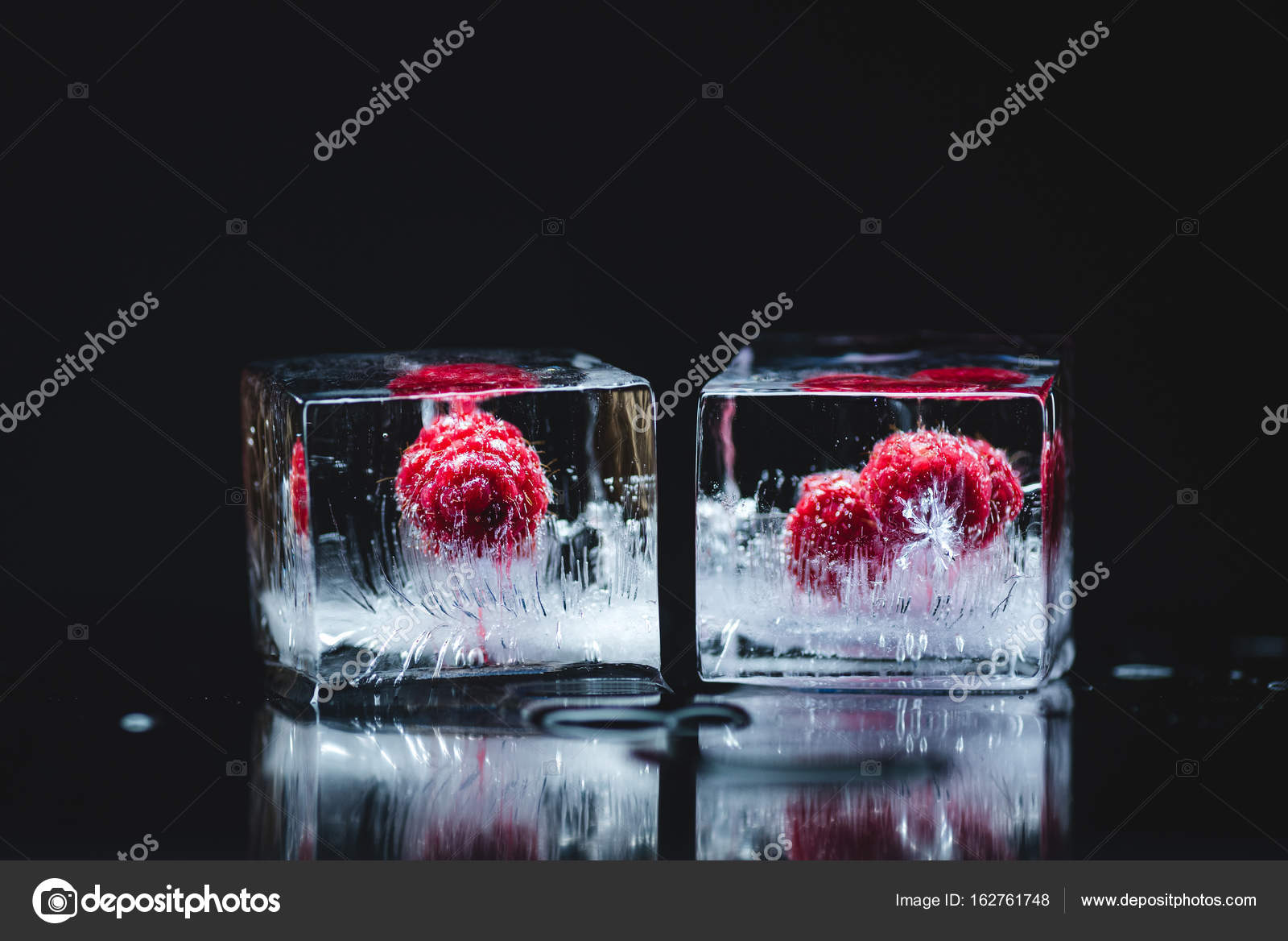 Raspberries frozen in ice cubes Stock Photo by ©VadimVasenin 162761748