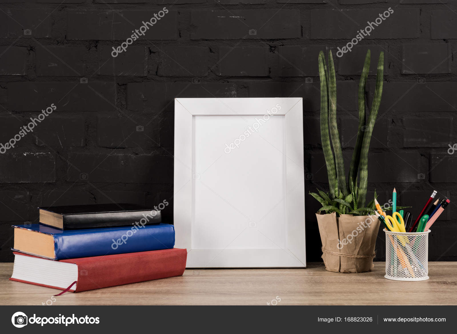 Photo frame and book on tabletop — Stock Photo © VadimVasenin #168823026