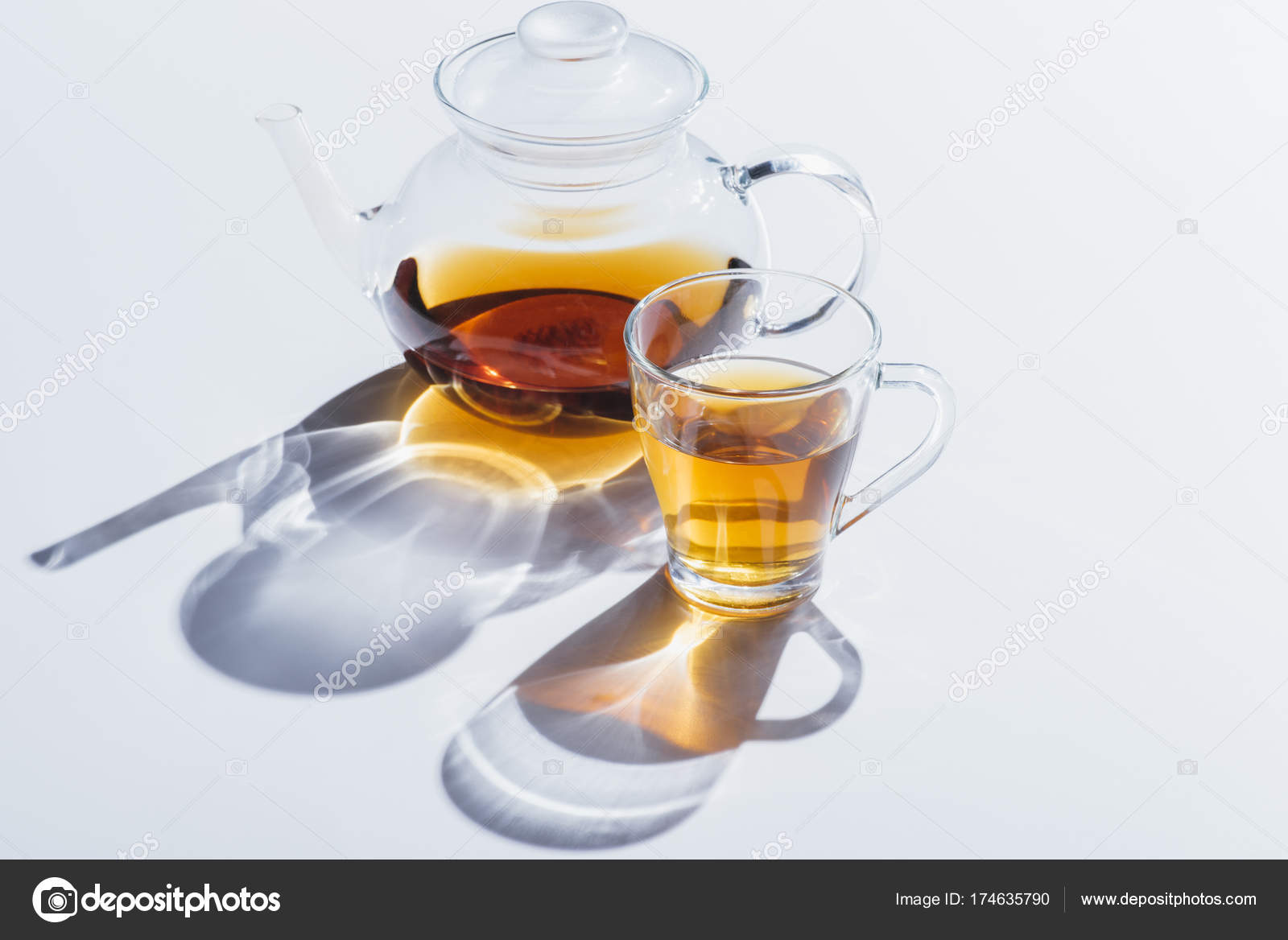 Herbal tea in cup and kettle — Stock Photo © VadimVasenin #174635790