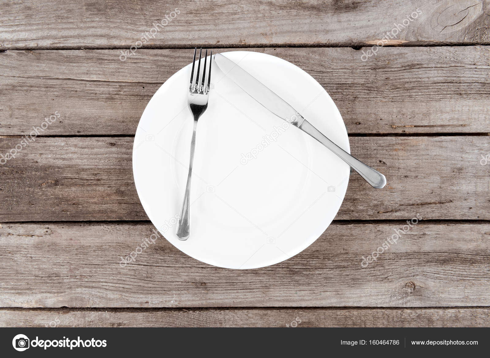 Empty plate and silverware on table — Stock Photo © AntonMatyukha ...