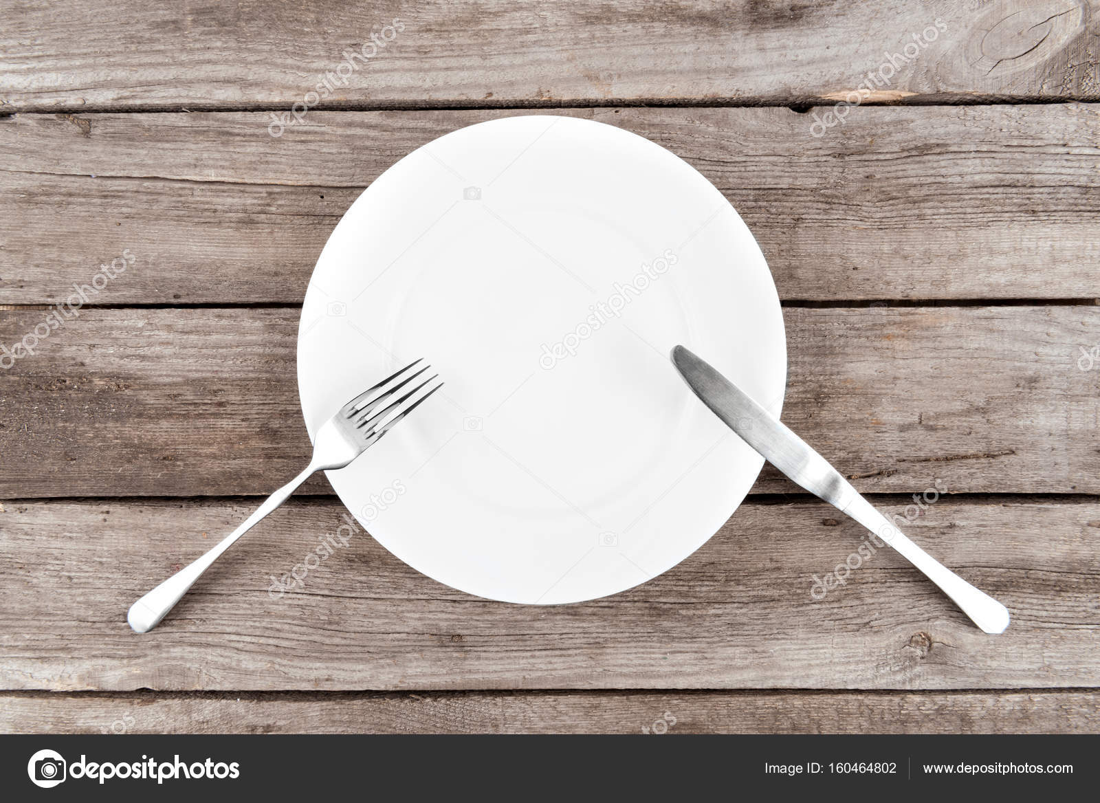 Empty plate and silverware on table — Stock Photo © AntonMatyukha ...