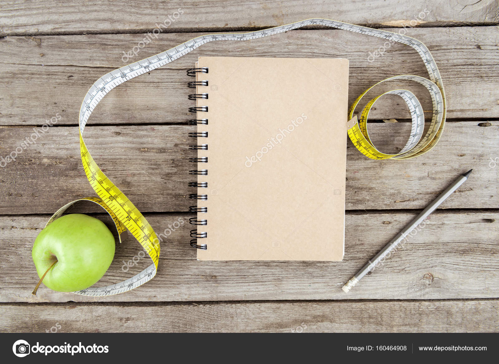 Notebook, fresh apple and measuring tape — Stock Photo © AntonMatyukha ...