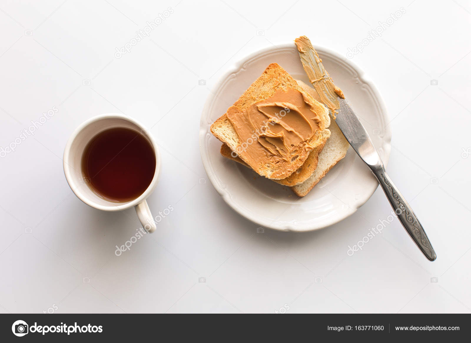 Toasts with peanut butter and tea — Stock Photo © AntonMatyukha #163771060