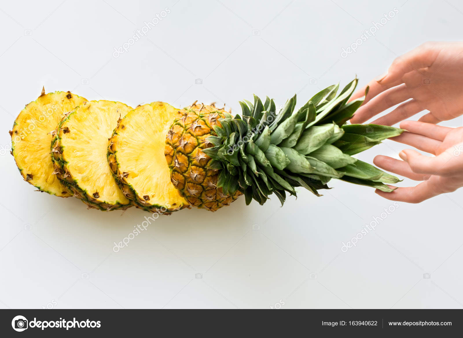 Hands with sliced fresh pineapple — Stock Photo © AntonMatyukha #163940622 Hands with sliced fresh pineapple — Stock Photo © AntonMatyukha #163940622