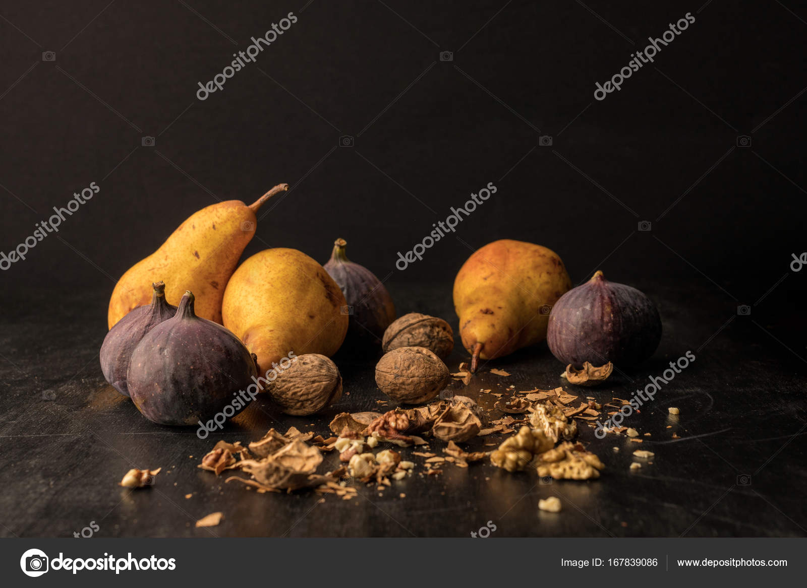 Pears, figs and walnuts — Stock Photo © AntonMatyukha #167839086