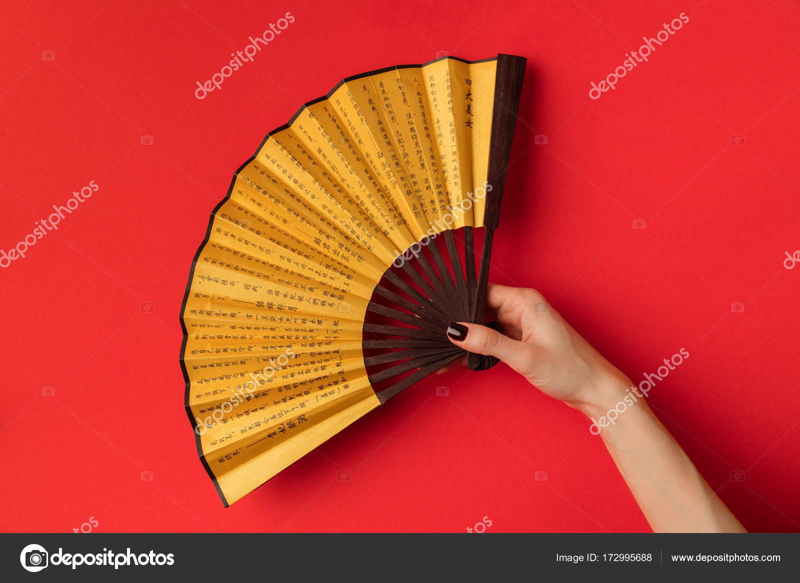 Oriental fan in hand — Stock Photo © AntonMatyukha #172995688