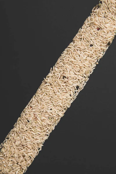 Raw Rice Isolated Black Copy Space — Stock Photo © AntonMatyukha #181213424