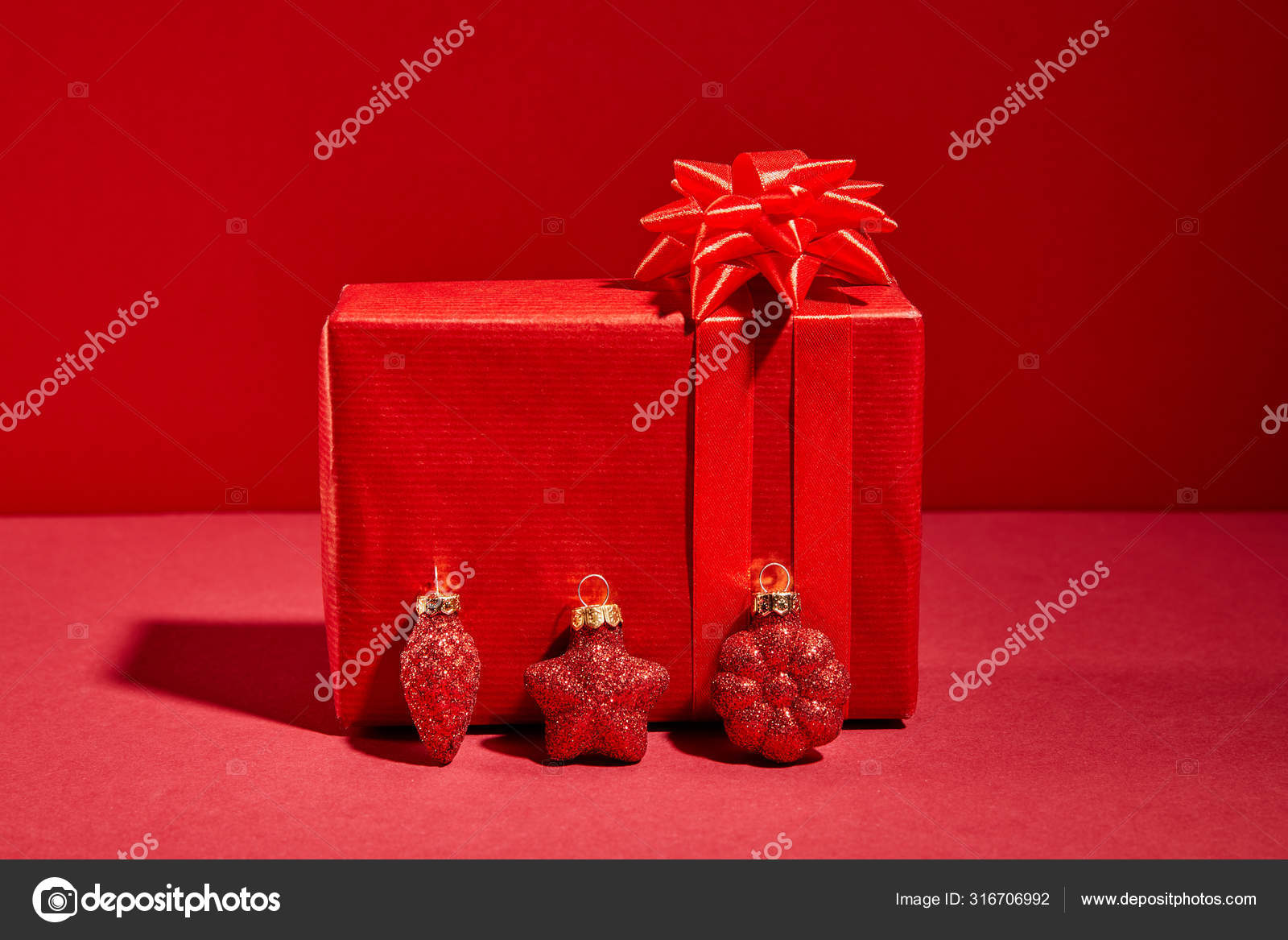 Red Wrapped Festive Gift Box Baubles Red Background — Stock Photo ...