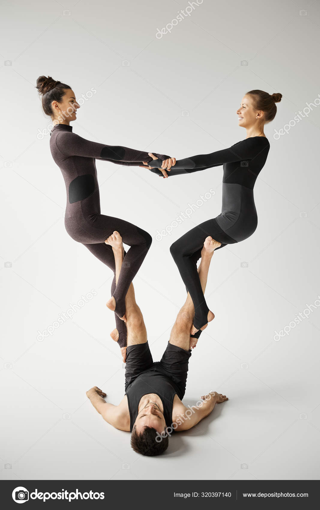 Three People Practicing Acroyoga Studio Stock Photo by ©AntonMatyukha ...