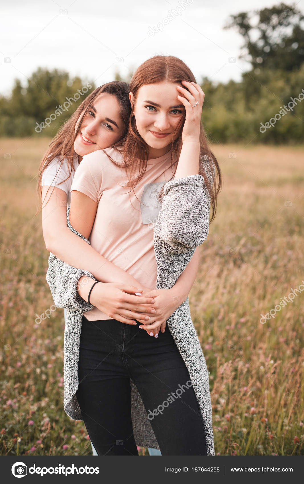 Two Girls Hugging Green Field Daytime Stock Photo by ©Dima_Aslanian ... Two Girls Hugging Green Field Daytime Stock Photo by ©Dima_Aslanian ...