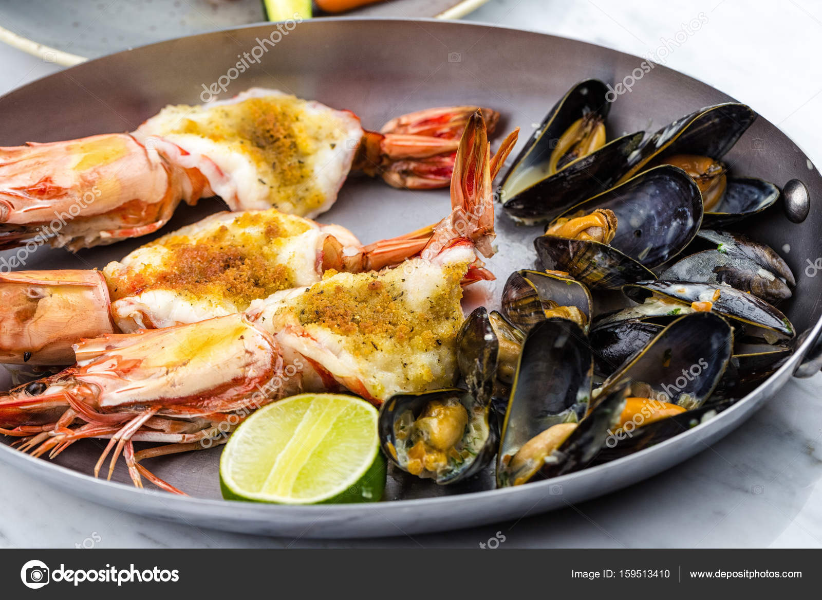 Royal prawns and mussel served in metal bowl Stock Photo by ©Begelart ...