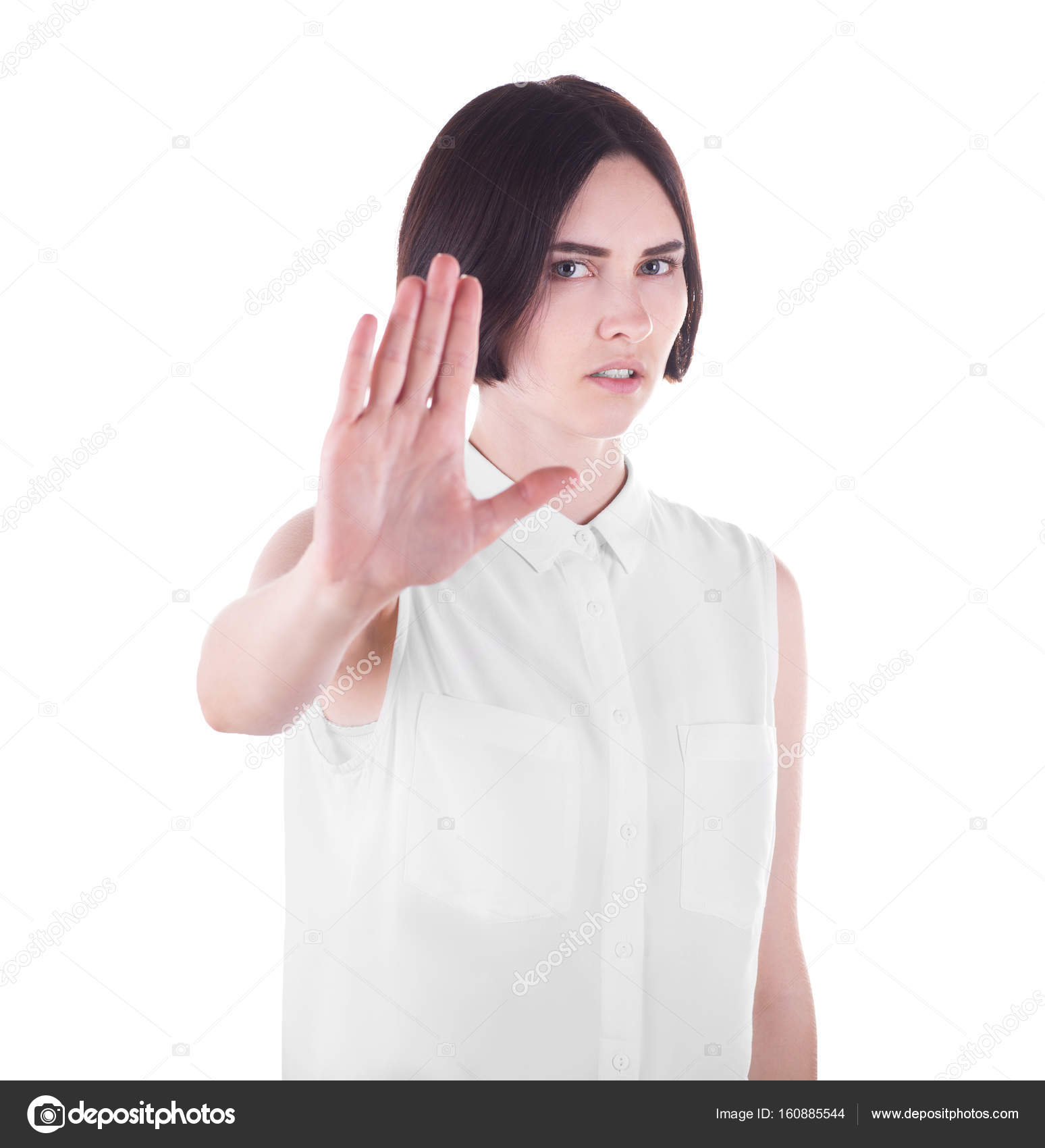 A sad office lady with dark brown hair and in a white blouse is showing ...