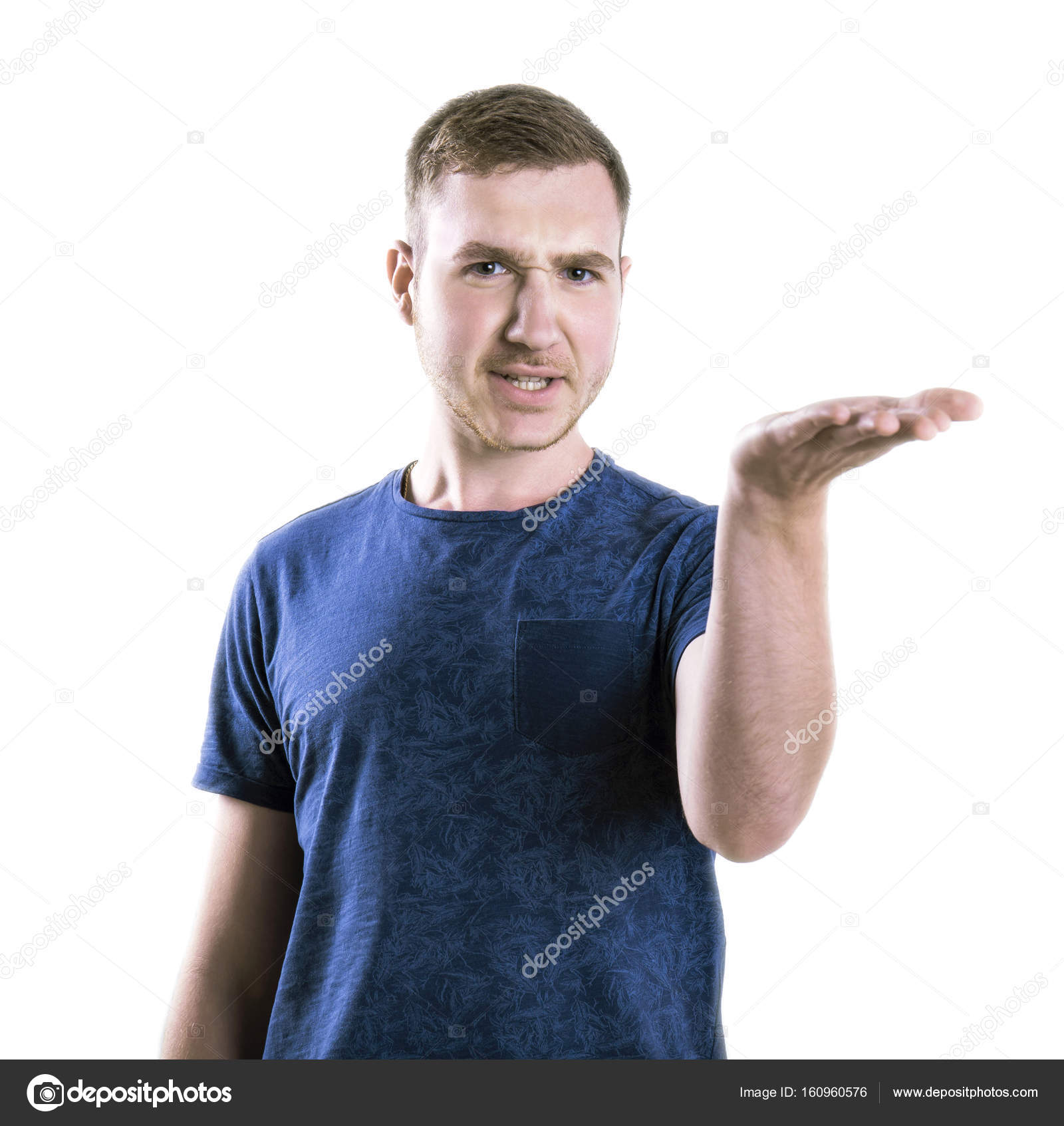 A frustrated guy puts out his hand in doubt. A stressed student ...