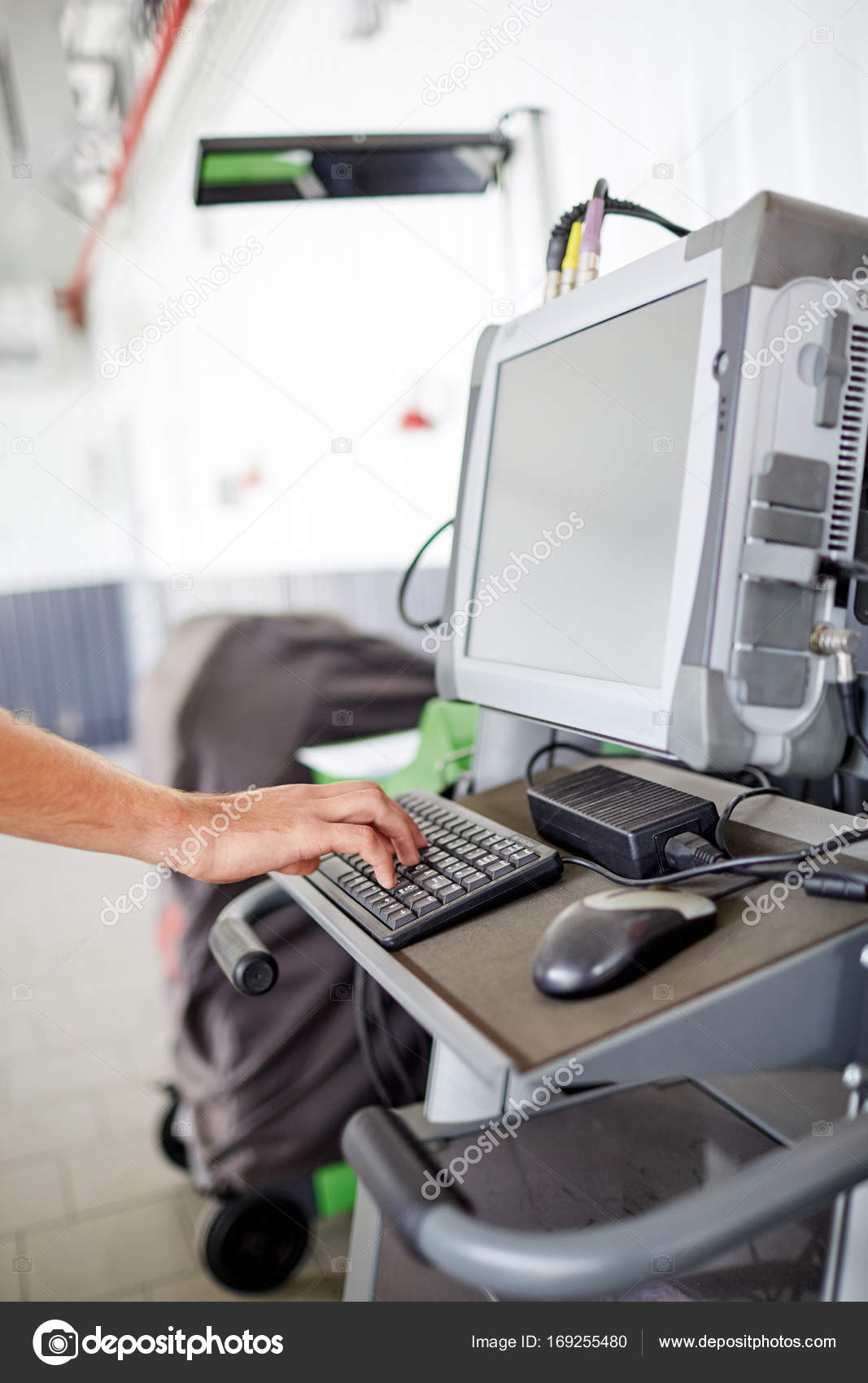 The mechanic carries out computer diagnostics of the car Stock Photo by ...