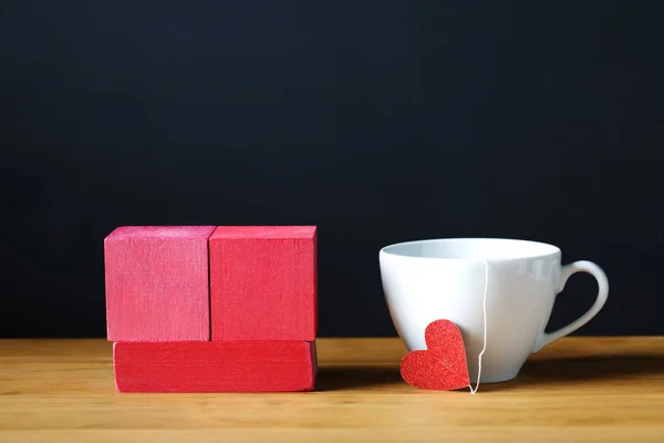 Coffee cup with wooden blocks Stock Photo by ©Melpomene 118849348