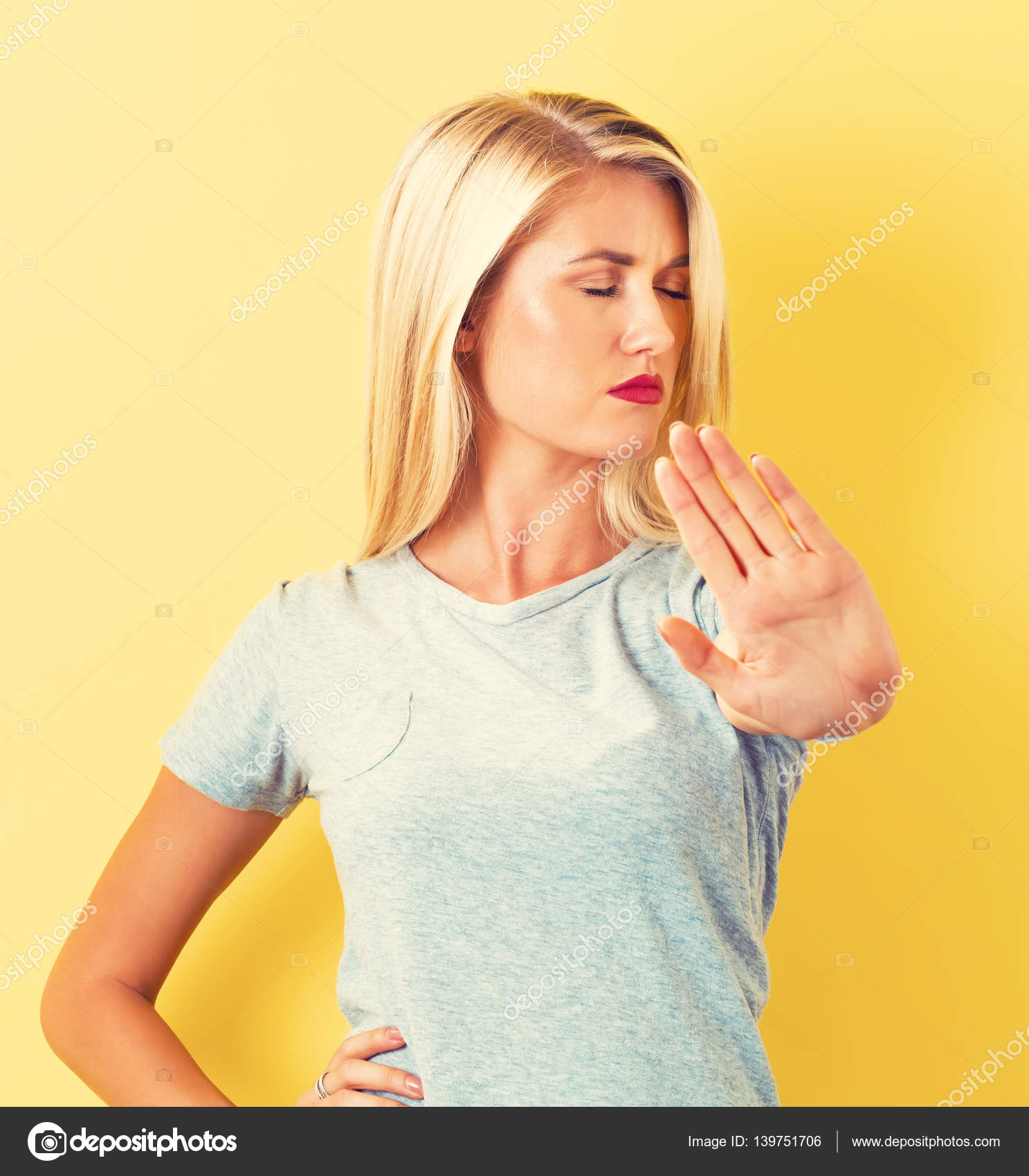 Young woman making a rejection pose Stock Photo by ©Melpomene 139751706
