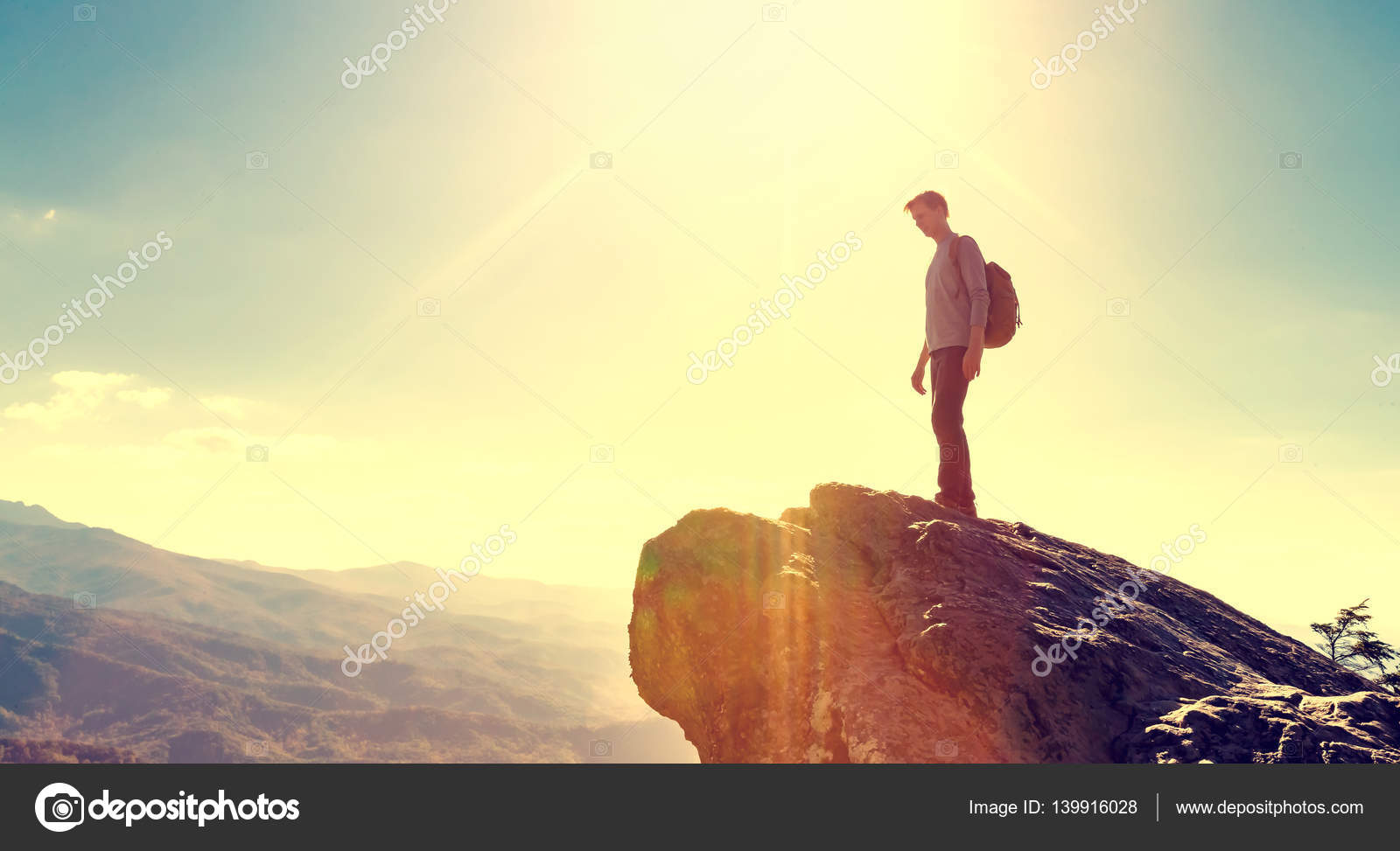 Man walking on the edge of a cliff Stock Photo by ©Melpomene 139916028