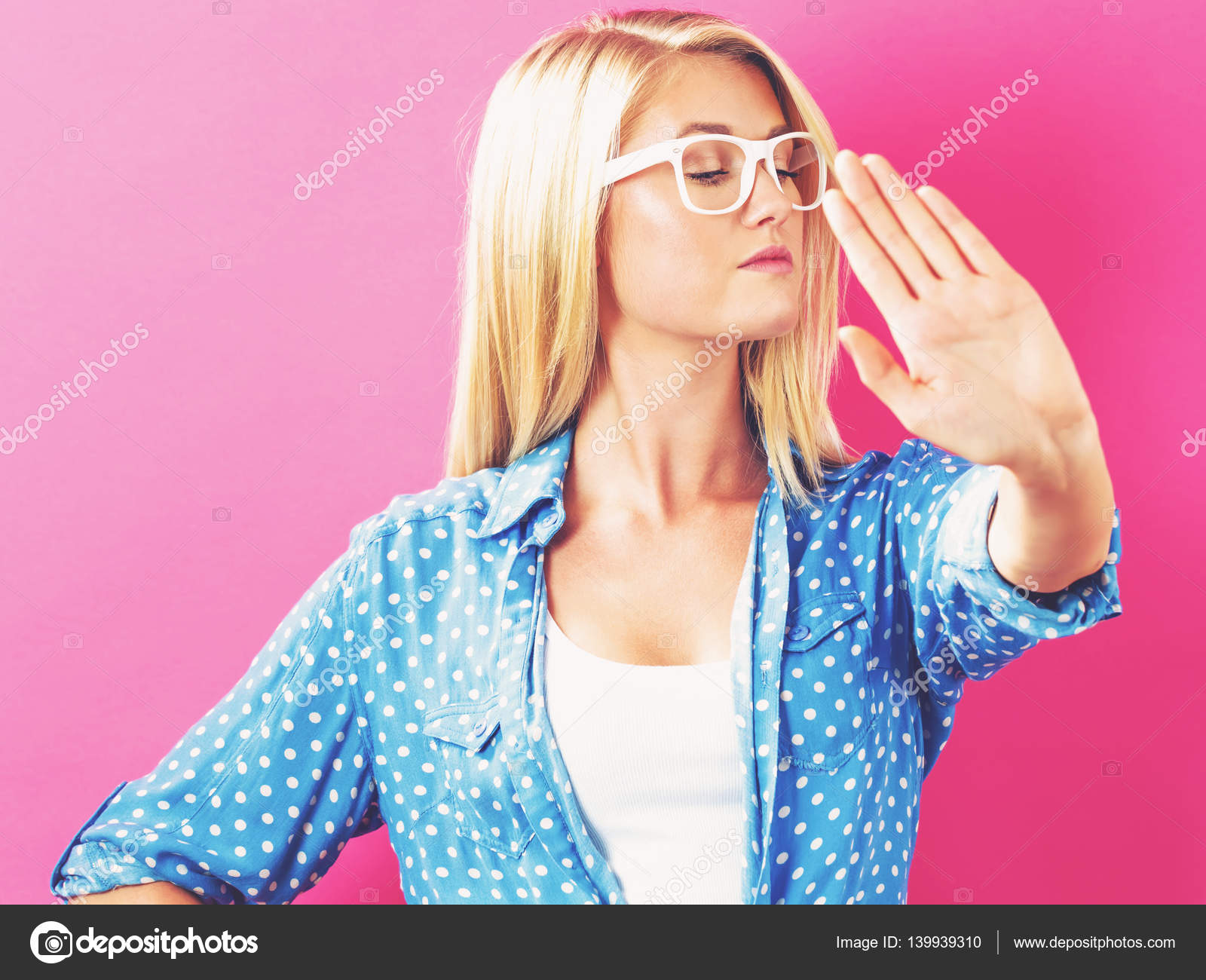 Young woman making a rejection pose Stock Photo by ©Melpomene 139939310