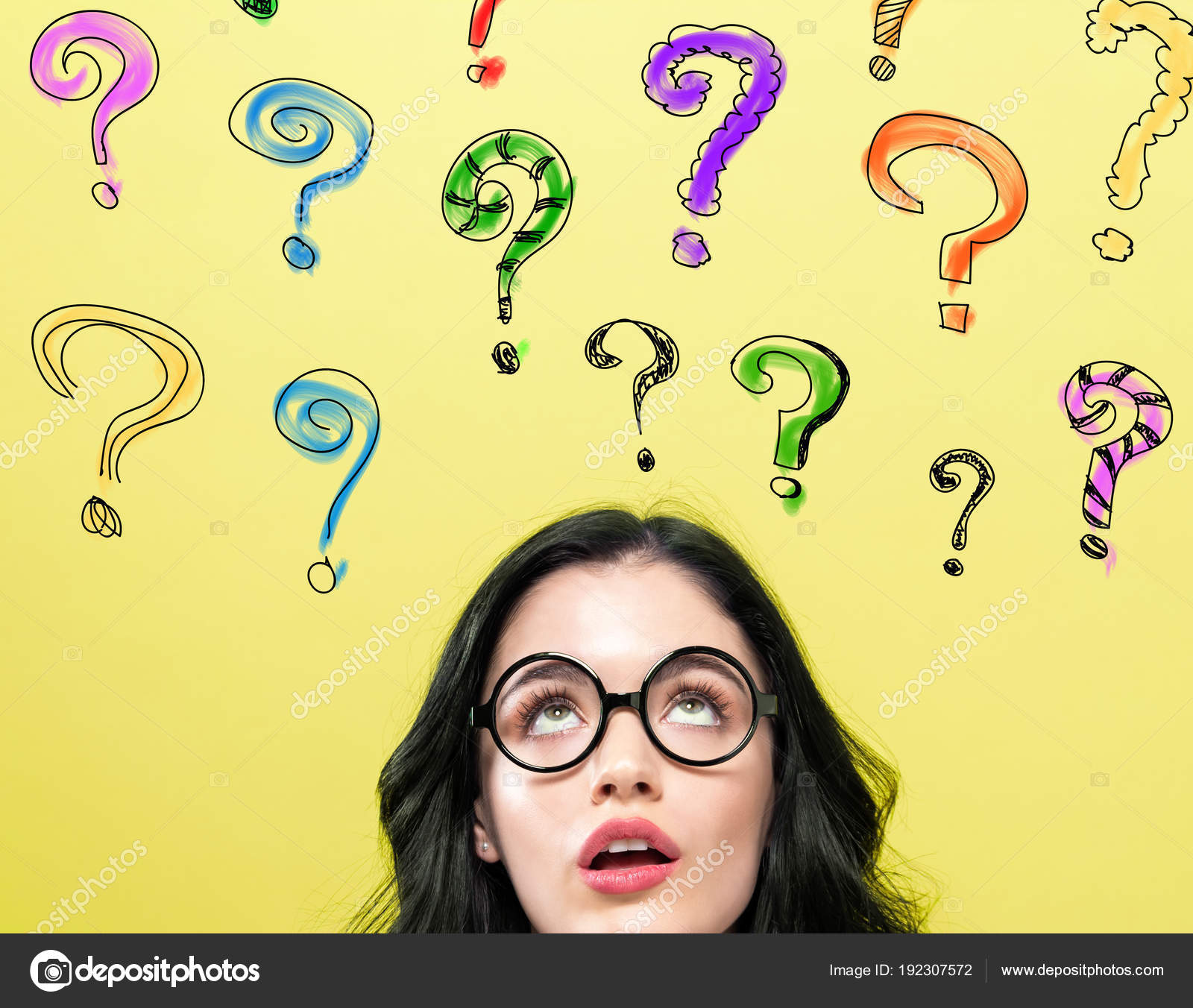 Question Marks with young woman — Stock Photo © Melpomene #192307572