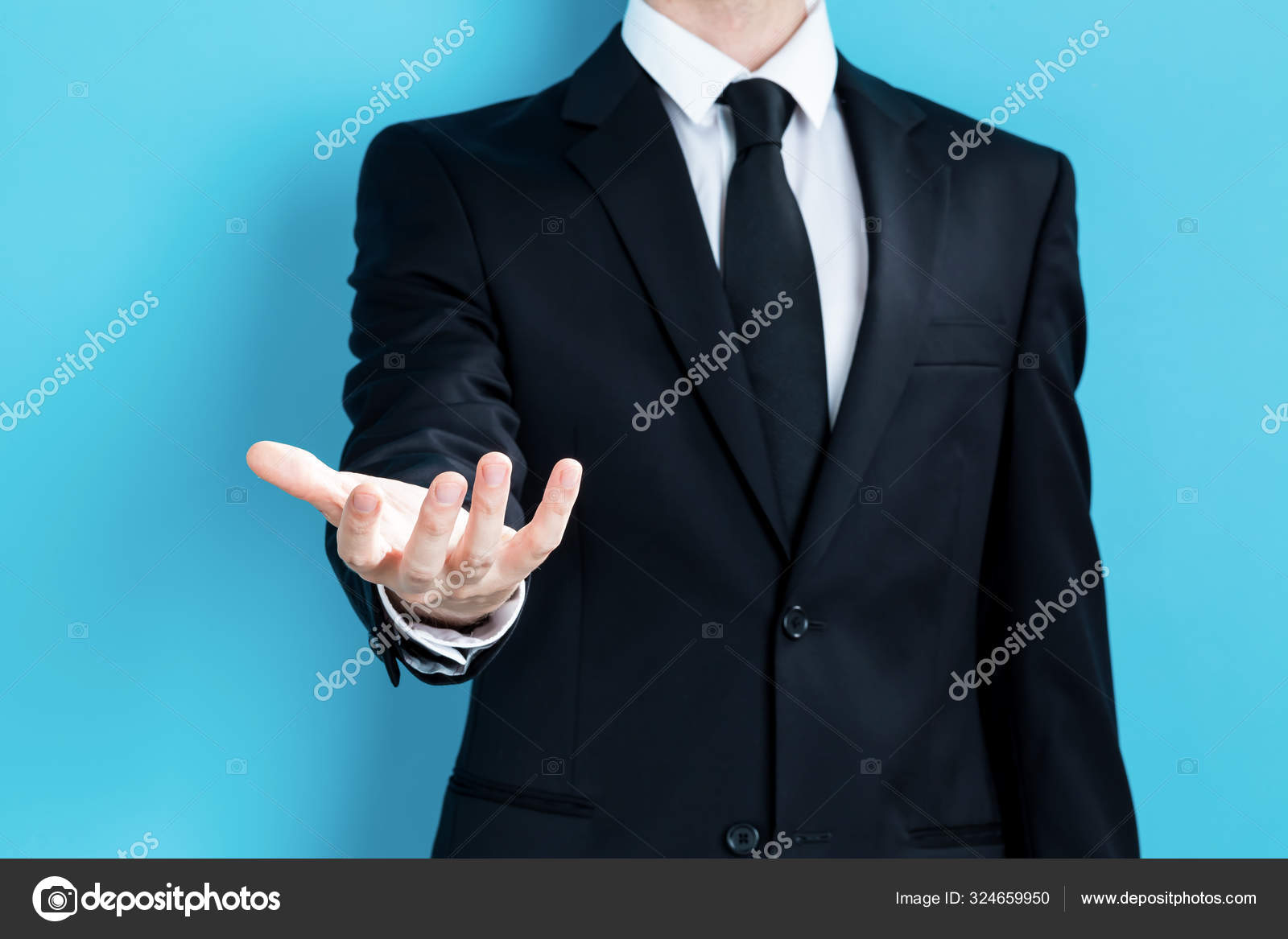 Businessman presenting something in his hand — Stock Photo © Melpomene ...