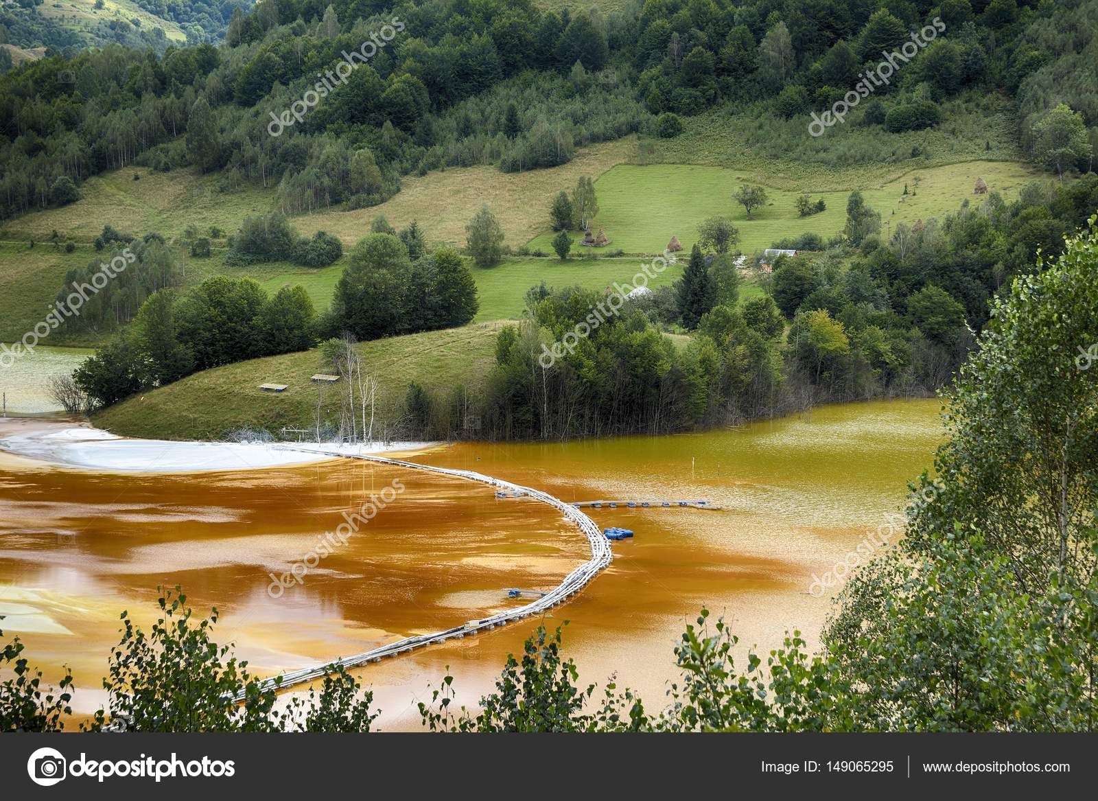 Pollution of a lake with contaminated water from a gold mine — Stock ...