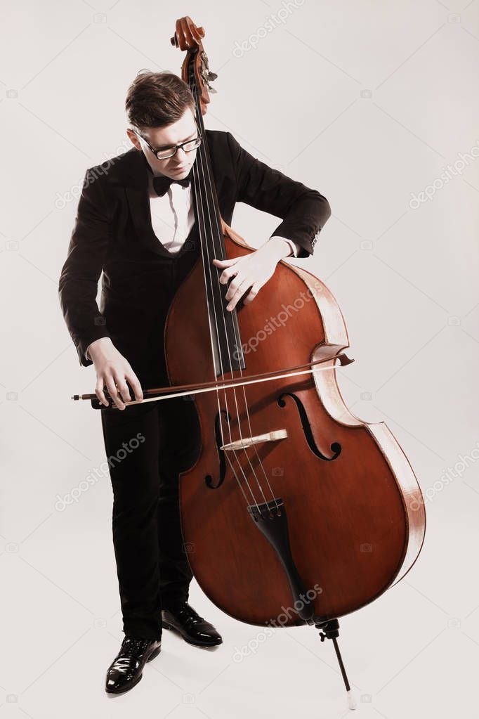 Double bass player playing contrabass — Stock Photo © alenavlad #169642154