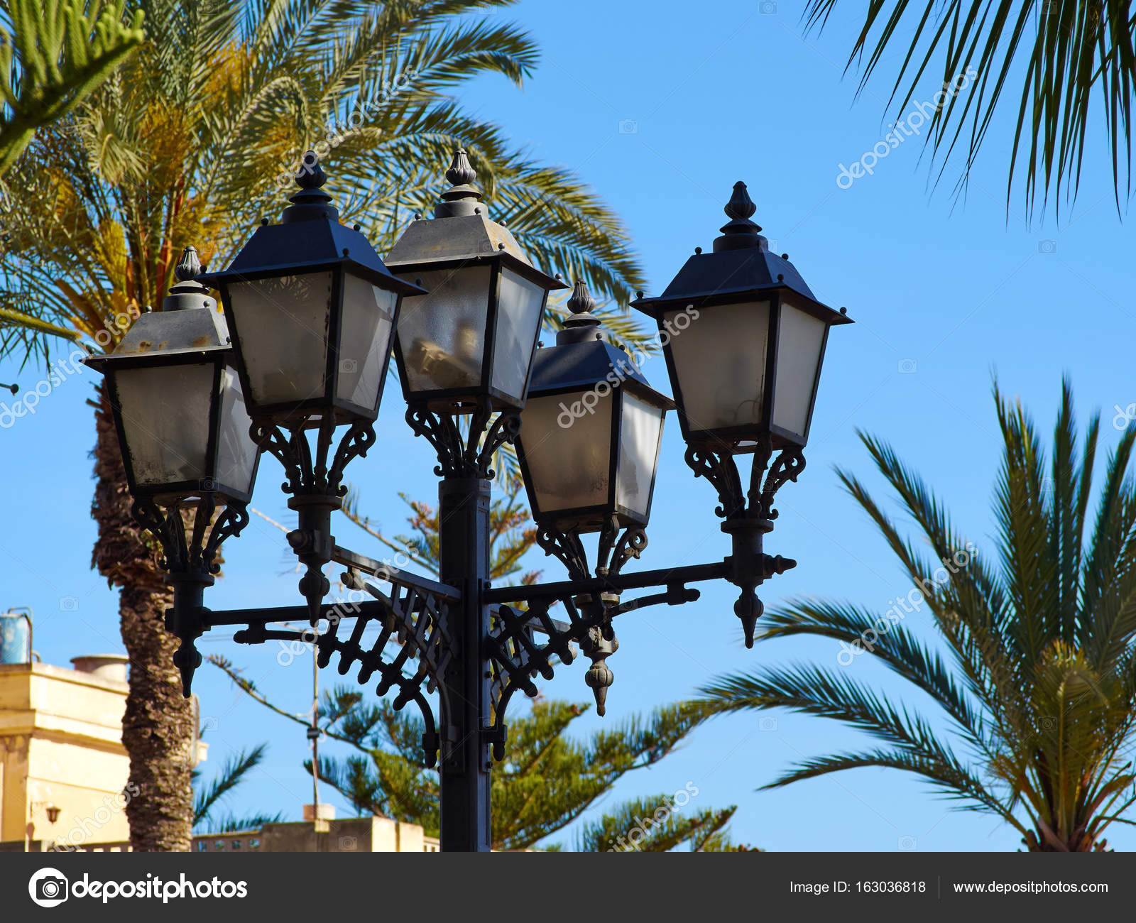 Typical Spanish decorated street lamp and lantern Stock Photo by ...