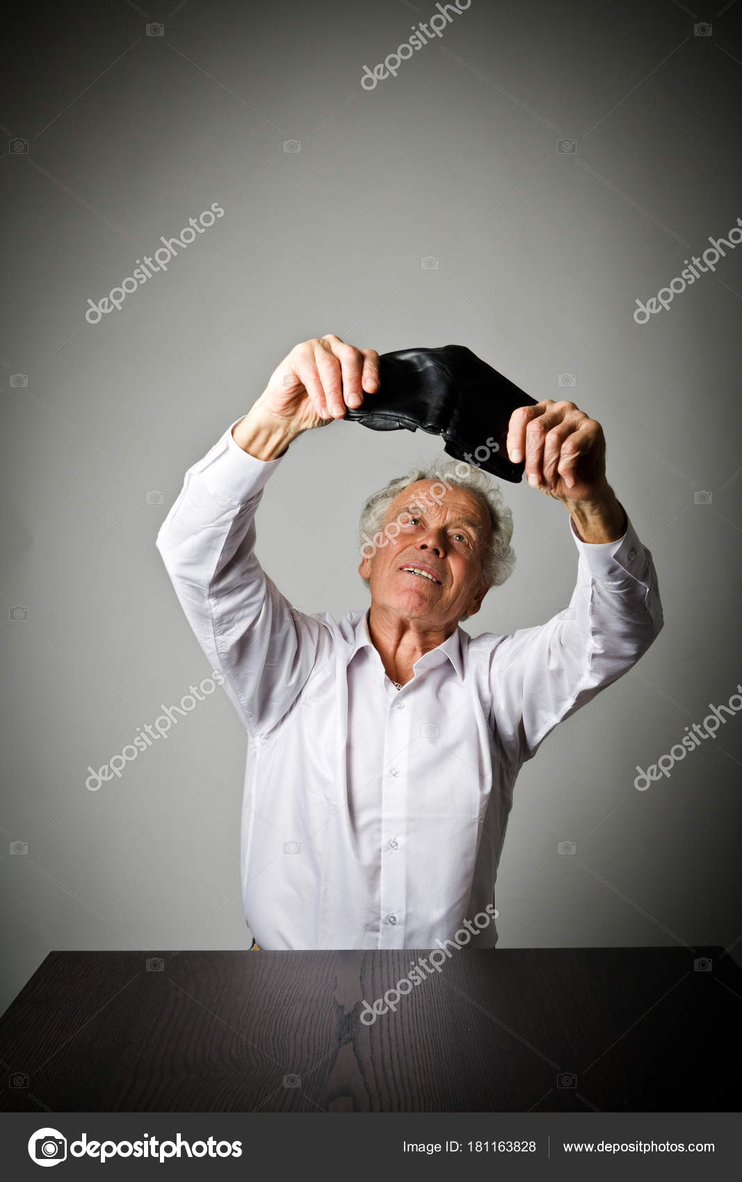 Old man in white and empty wallet. Stock Photo by ©maurus 181163828