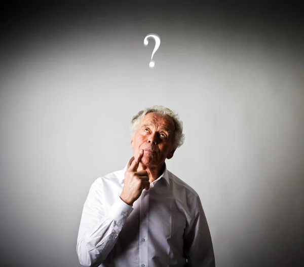 Old man and question mark. Stock Photo by ©maurus 332632304