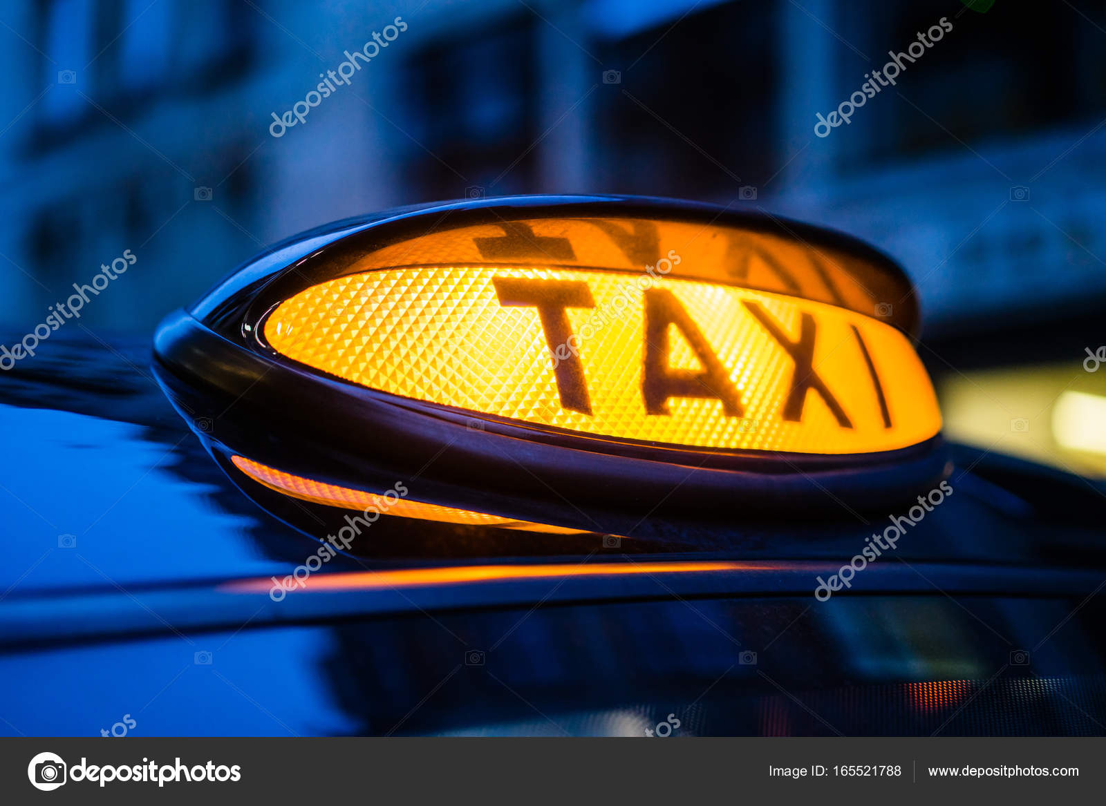 An illuminated taxi sign Stock Photo by ©pabkov 165521788