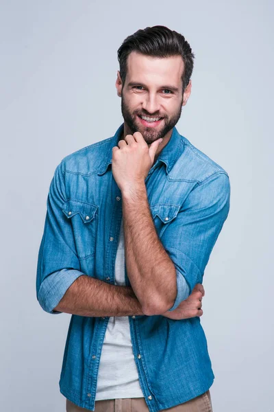 Cutie in blue shirt. Handsome young man looking at camera with smile ...