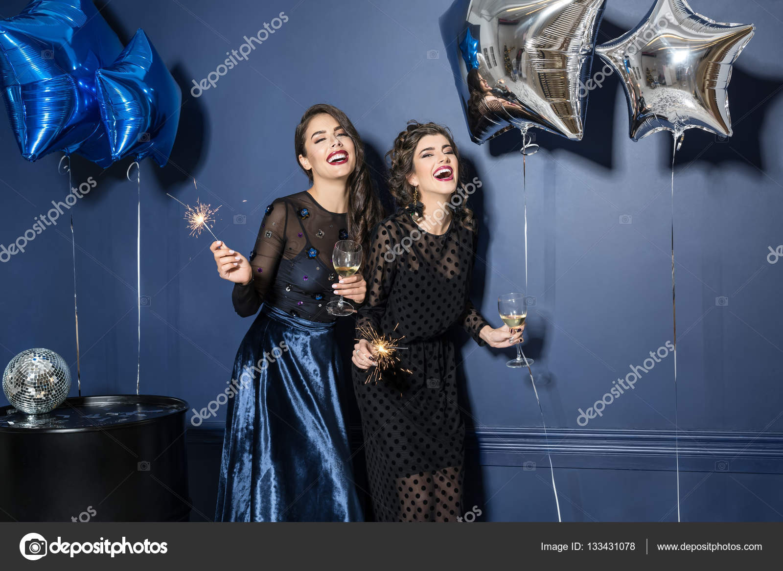 Girls celebrate in studio Stock Photo by ©bezikus 133431078