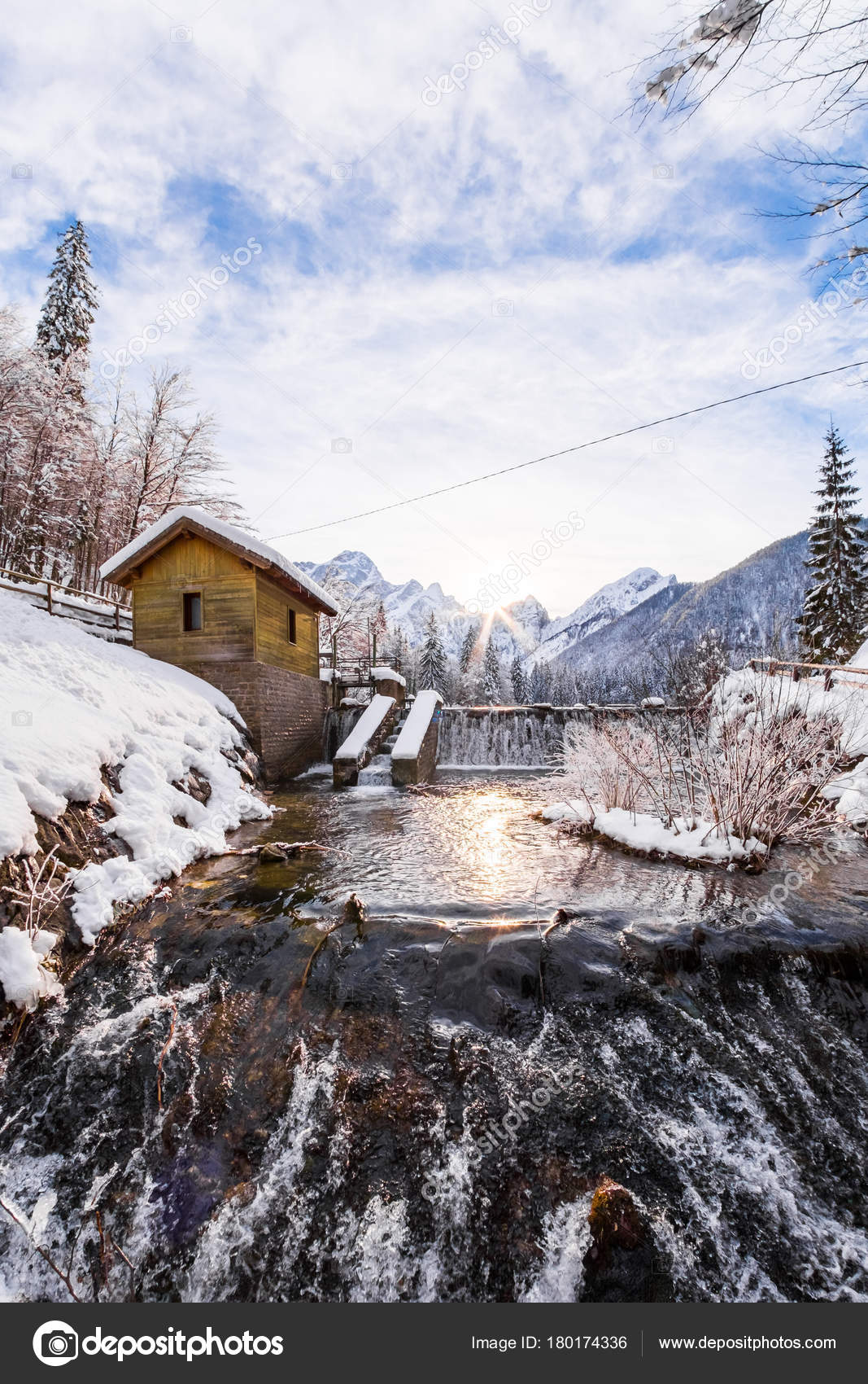 Water from lake Fusine flows over dam in river Stock Photo by ...