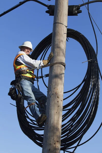 Power lineman Stock Photos, Royalty Free Power lineman Images ...