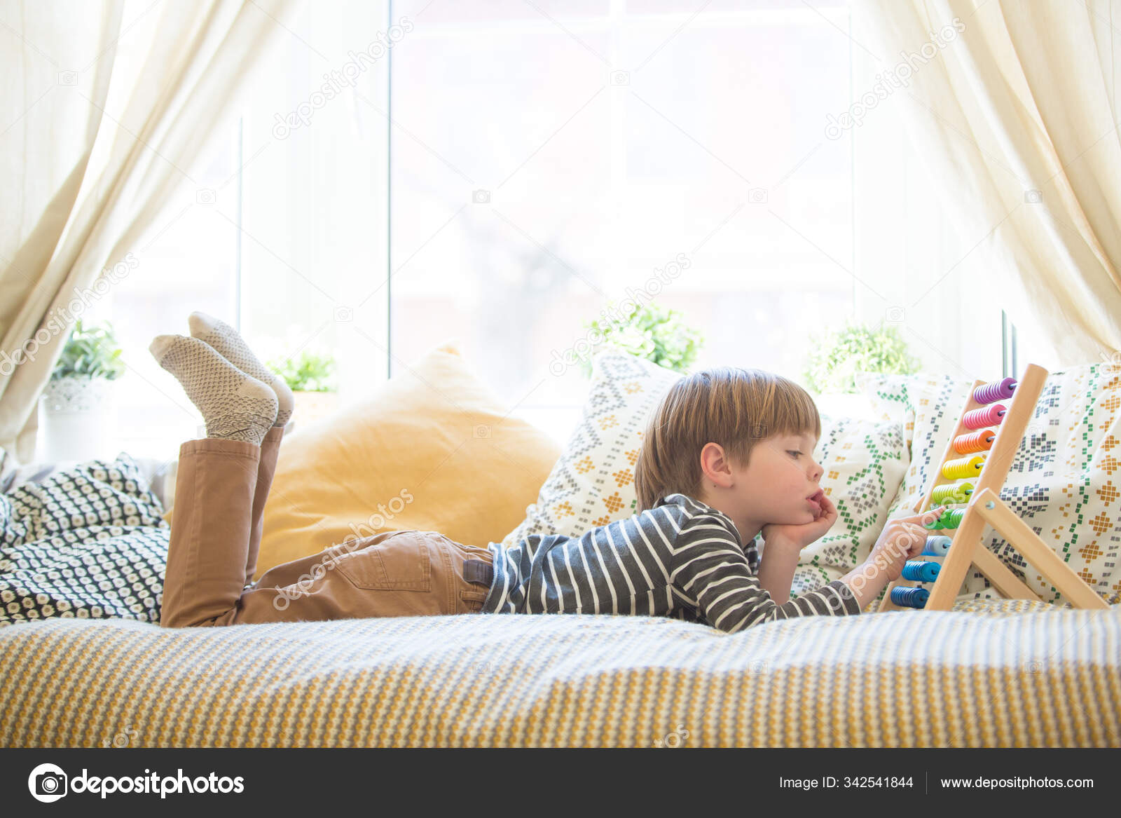 Boy learns to count Stock Photo by ©kirill_grekov 342541844